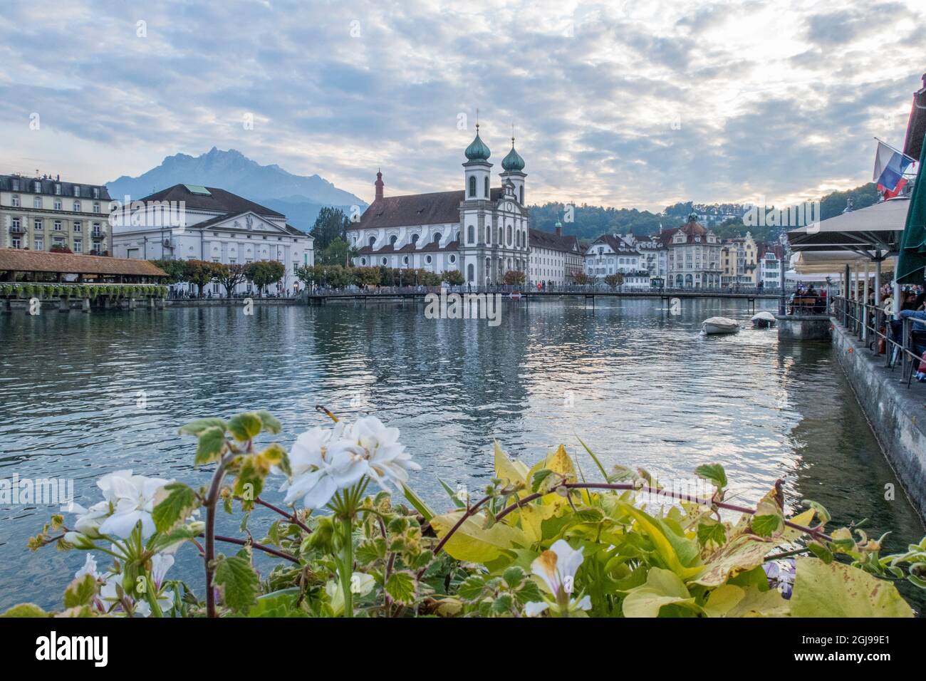 Lake Lucerne, Switzerland. Famous walking bridge and swans in river ...