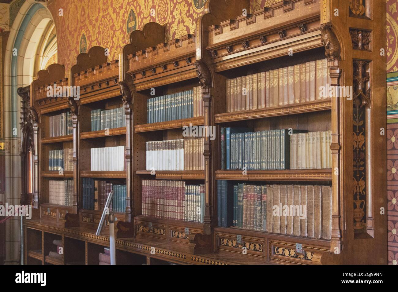 Bookshelves lining the walls of the library in Cardiff Castle Stock ...