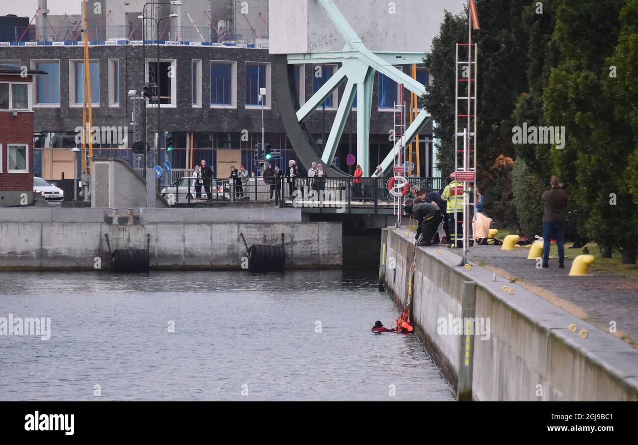 Divers survey the scene after Chris Stokes from Liverpool, England ...