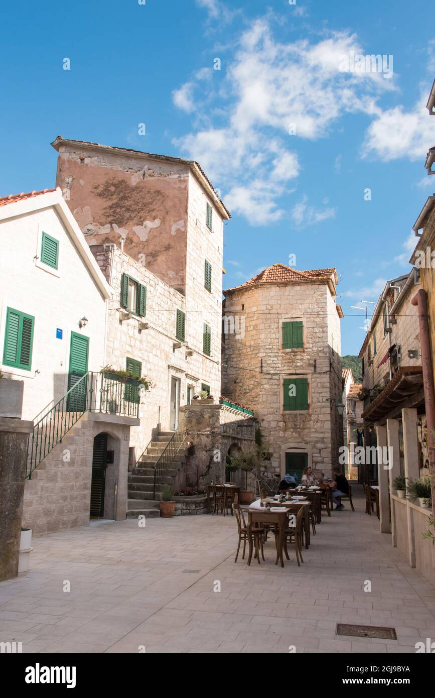 Croatia, Hvar Island, Stari Grad. Uncrowded courtyard restaurant Stock ...