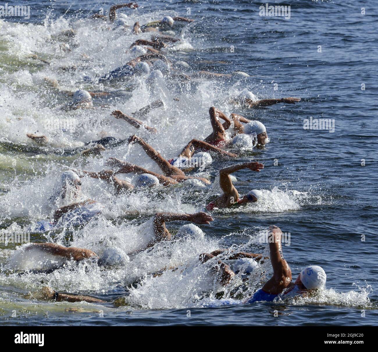 STOCKHOLM 2015-08-22 Triathletes during the 1500 m swimming leg of the ...