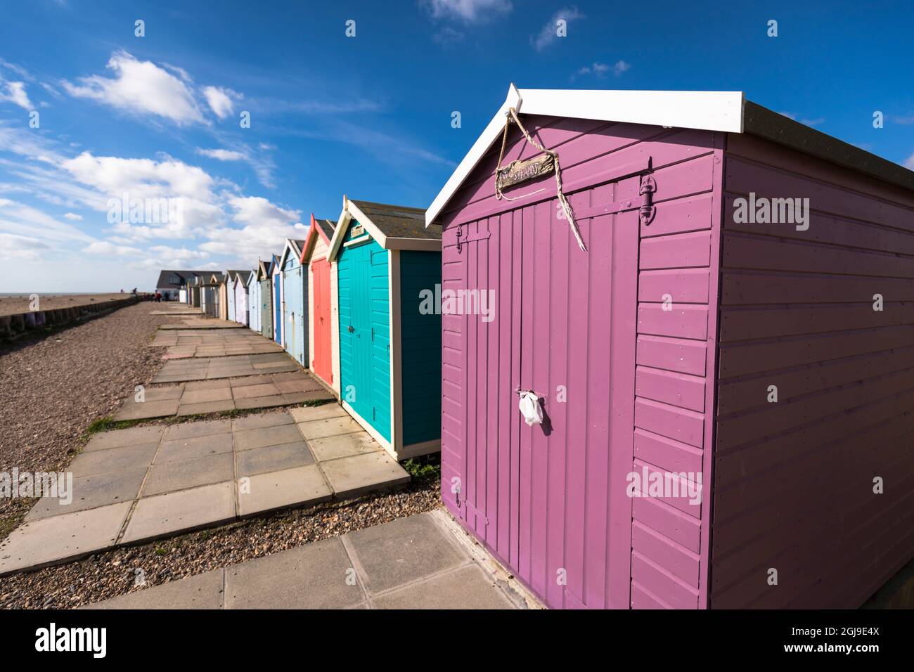 England, West Sussex, Ferring. Iconic beach huts along the coast ...
