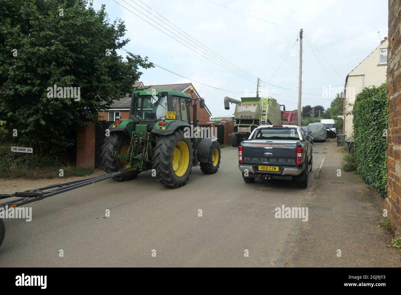 Moving farm machinery in Ringstead Northamptonshire Village UK Stock ...