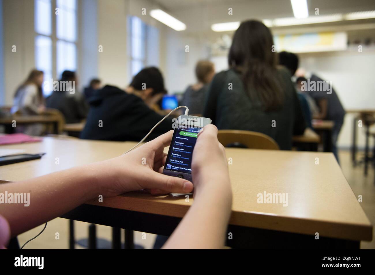 STOCKHOLM 20141217 A student using a mobile phone during a lesson in a ...