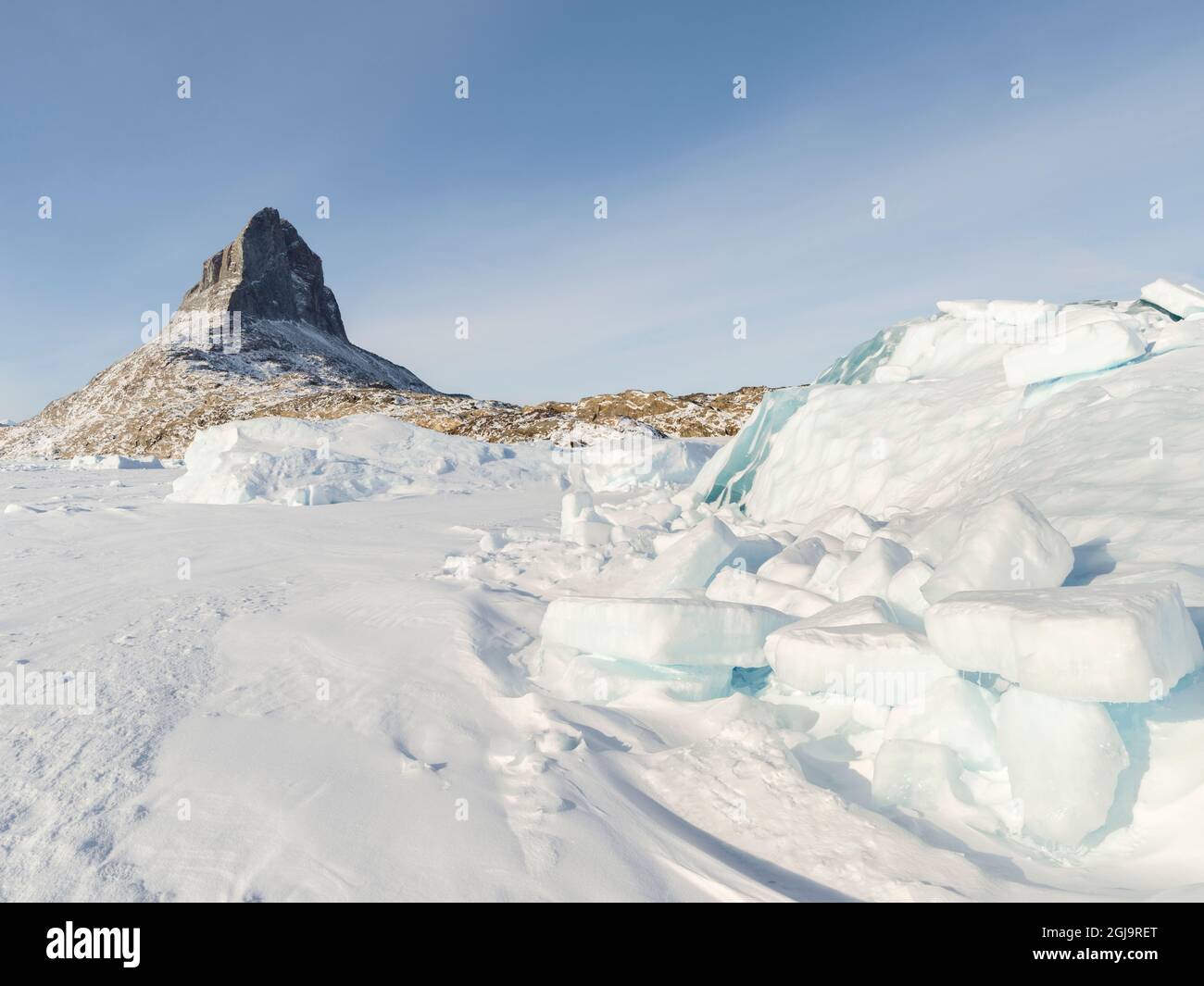 Icebergs frozen into the sea ice of the Uummannaq Fjord System near ...