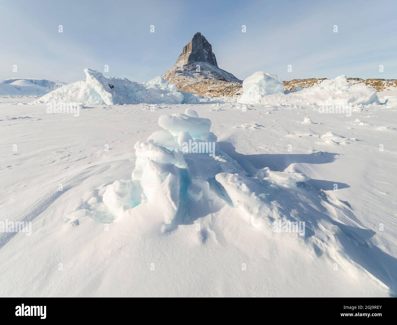 Icebergs frozen into the sea ice of the Uummannaq Fjord System near ...