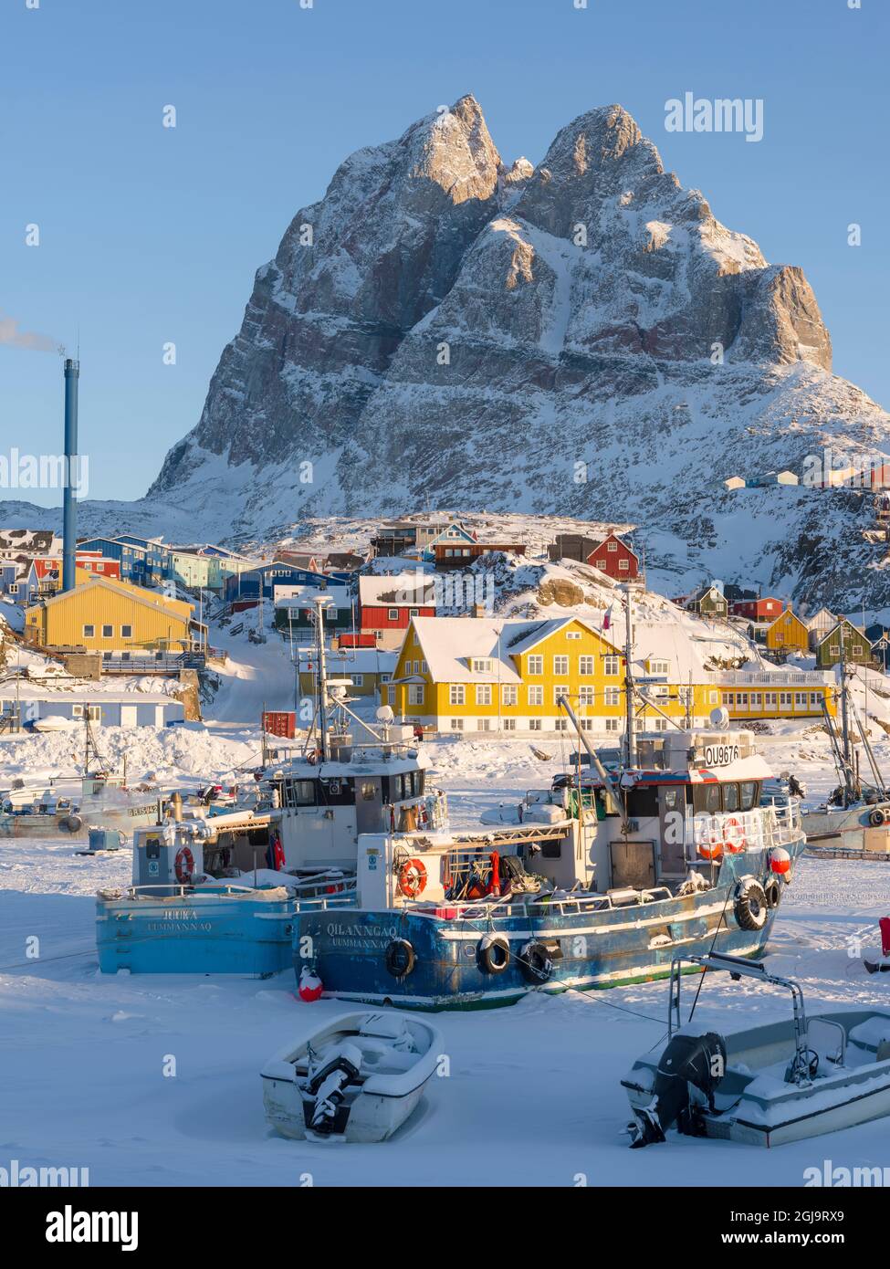 Town Uummannaq during winter in northern Greenland. Ships in the frozen ...