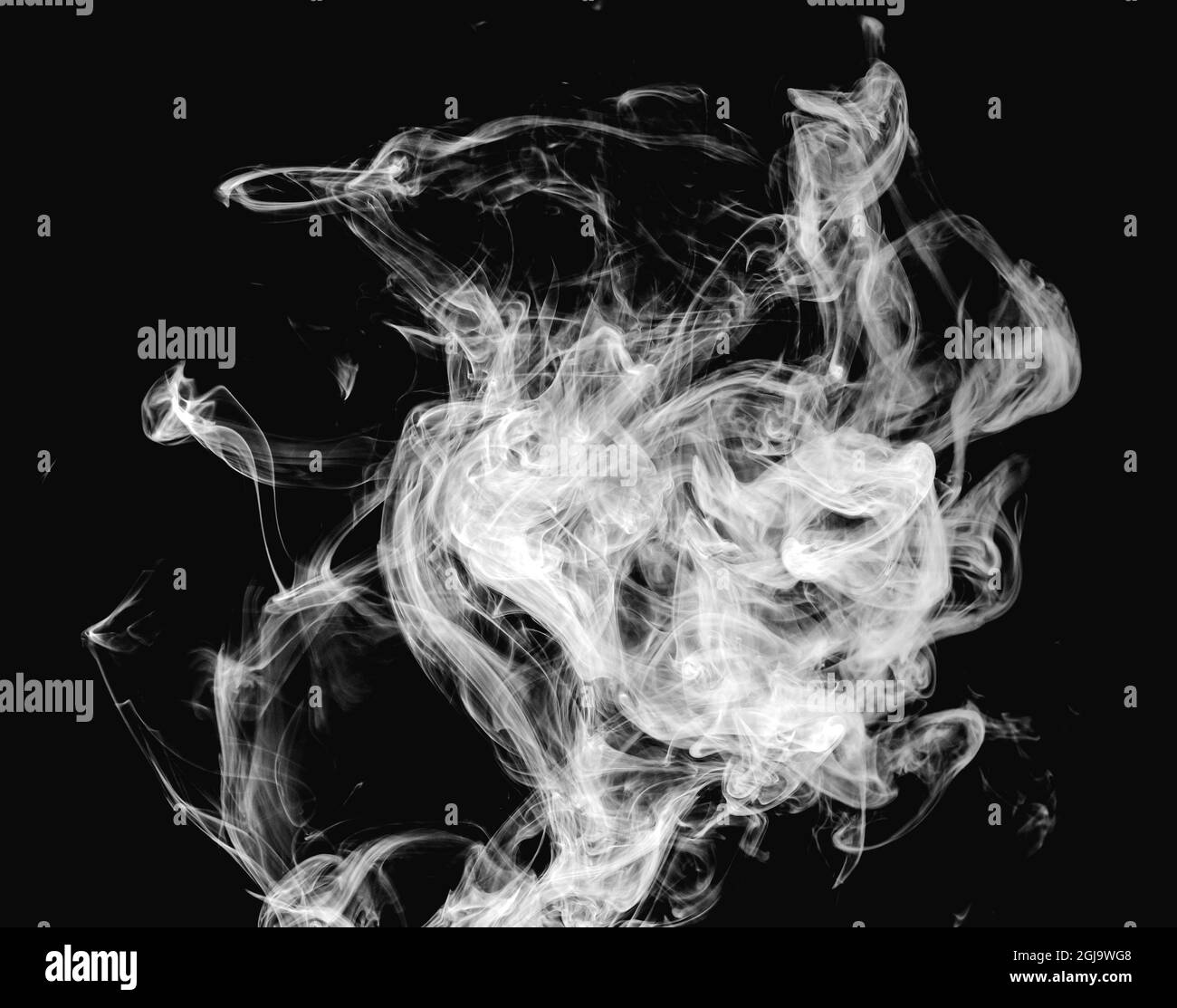 White twisting smoke isolated on black background. Transparent vapor in ...
