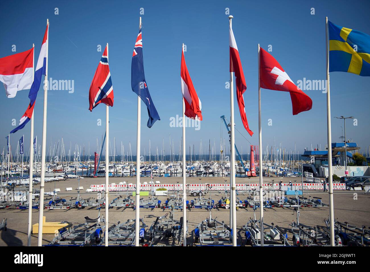 09 September 2021, Schleswig-Holstein, Kiel: Flags of different countries fly over the sports ...