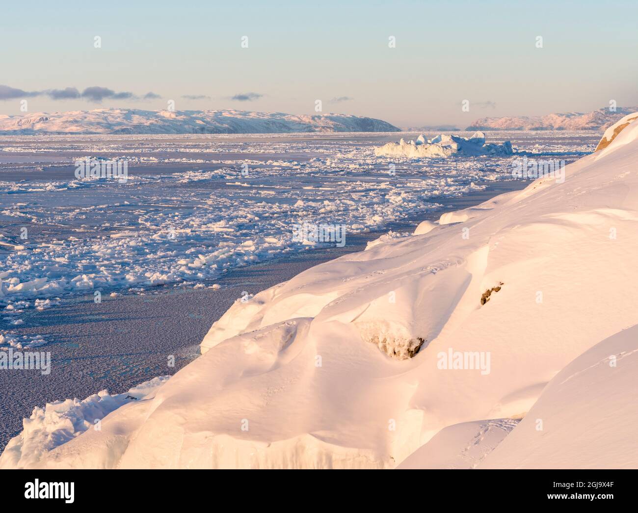Frozen Disko Bay during winter, West Greenland, Disko Island in the ...