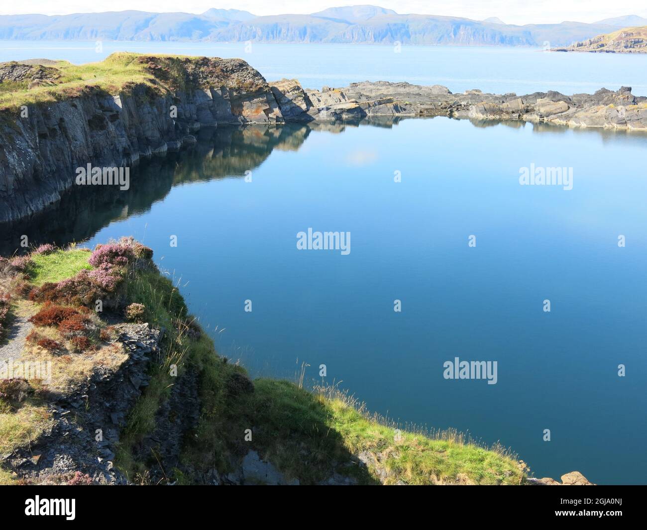 Deep rock pools & clear blue water: the Slate Islands in western ...