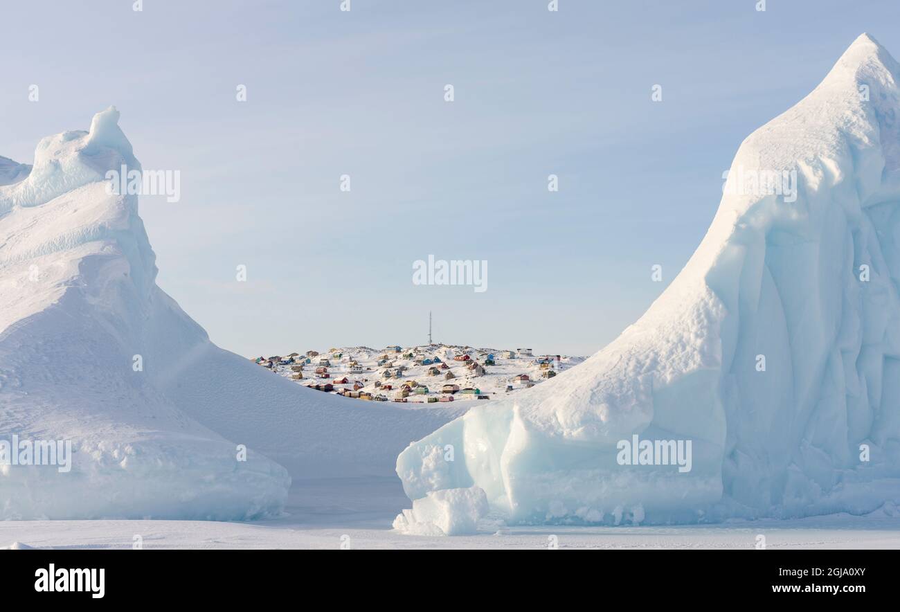 The traditional and remote Greenlandic Inuit village Kullorsuaq located ...