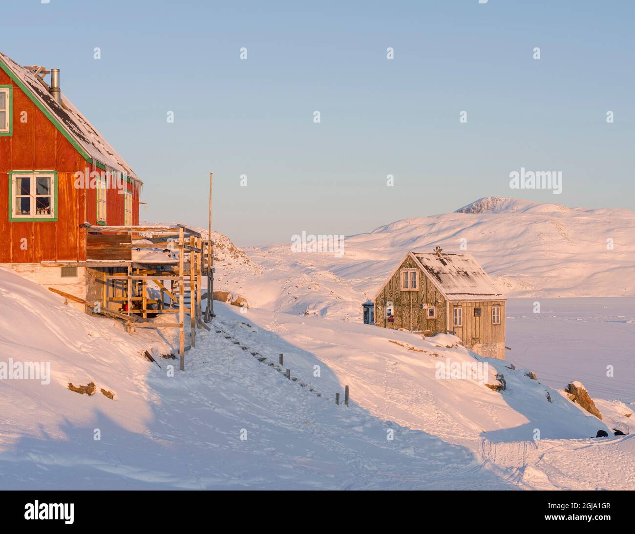 The traditional and remote Greenlandic Inuit village Kullorsuaq located ...