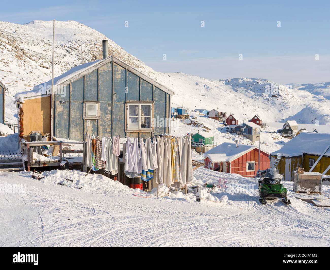 The traditional and remote Greenlandic Inuit village Kullorsuaq located ...