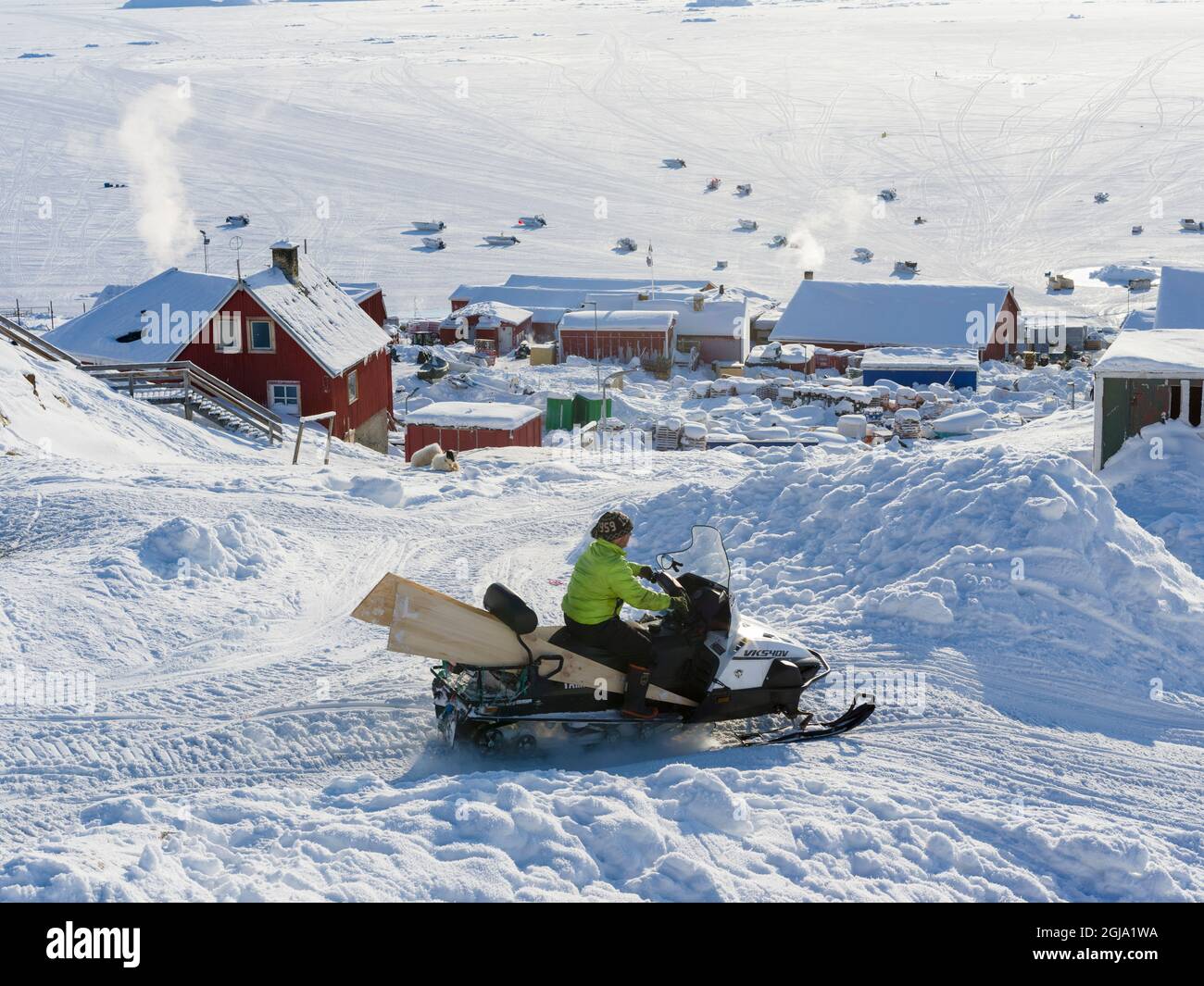The traditional and remote Greenlandic Inuit village Kullorsuaq located ...