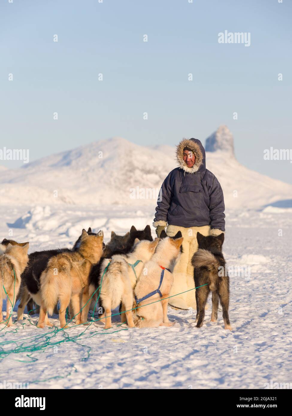 Inuit hunter wearing traditional trousers and boots made from polar ...