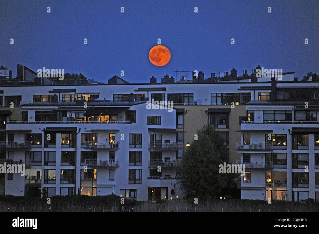 STOCKHOLM 2016-05-22 Full moon over buildnings,residential, housing ...