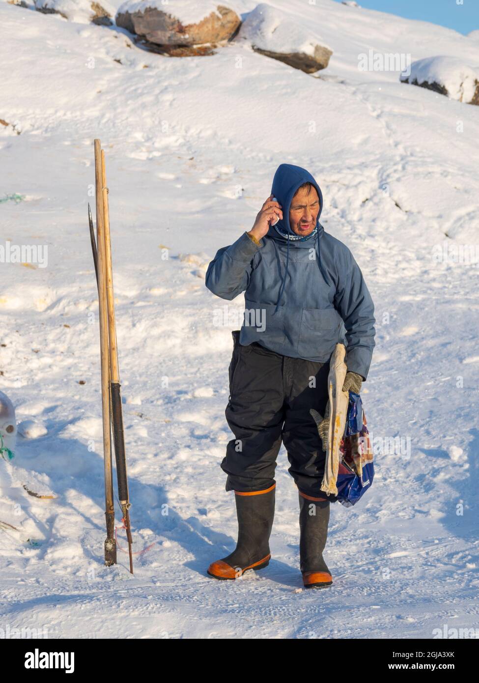Inuit hunter is getting ready. The traditional and remote Greenlandic ...