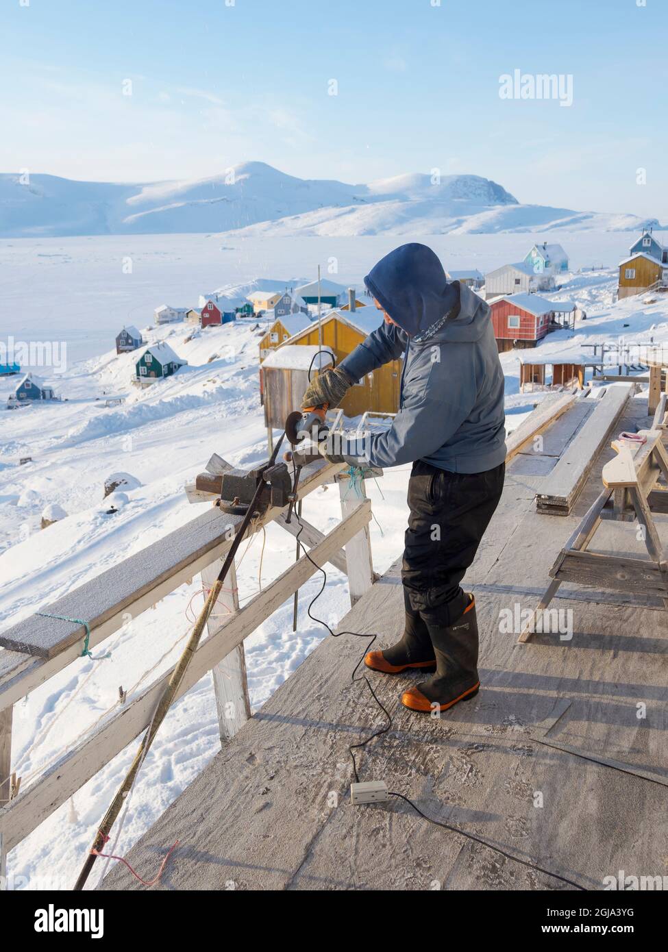Inuit hunter is preparing his tools. The traditional and remote ...