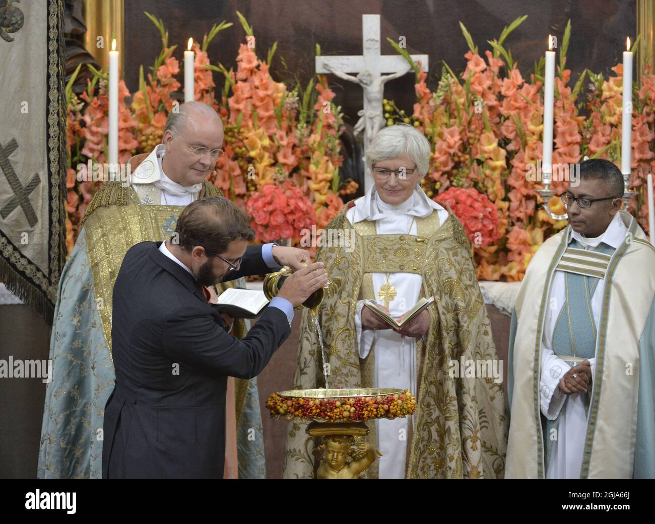 STOCKHOLM 20160909 Godfather Victor magnuson poor the Christening wate ...