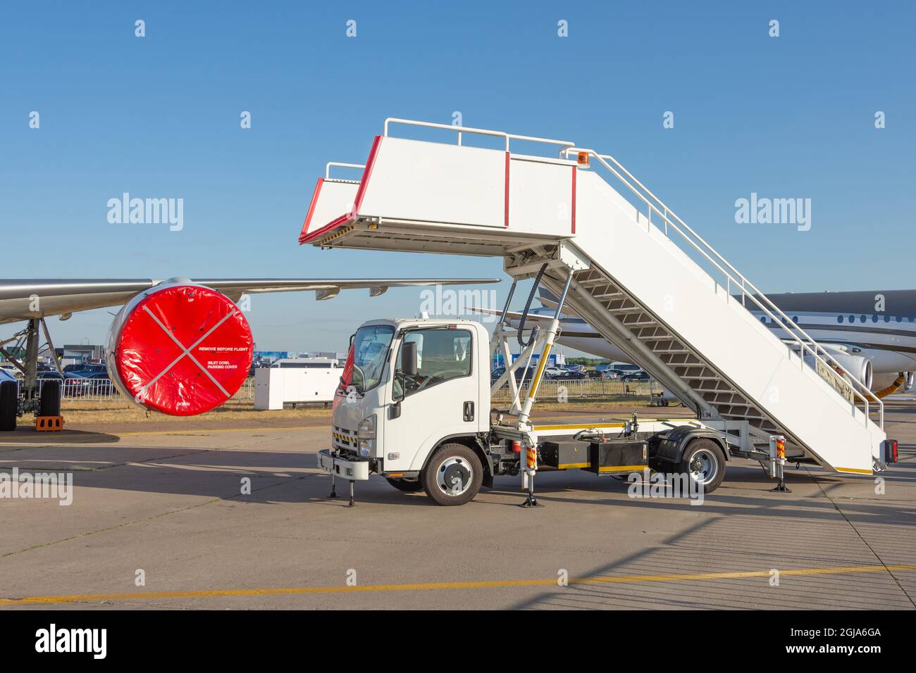 Car ladder for boarding passengers on the plane Stock Photo - Alamy