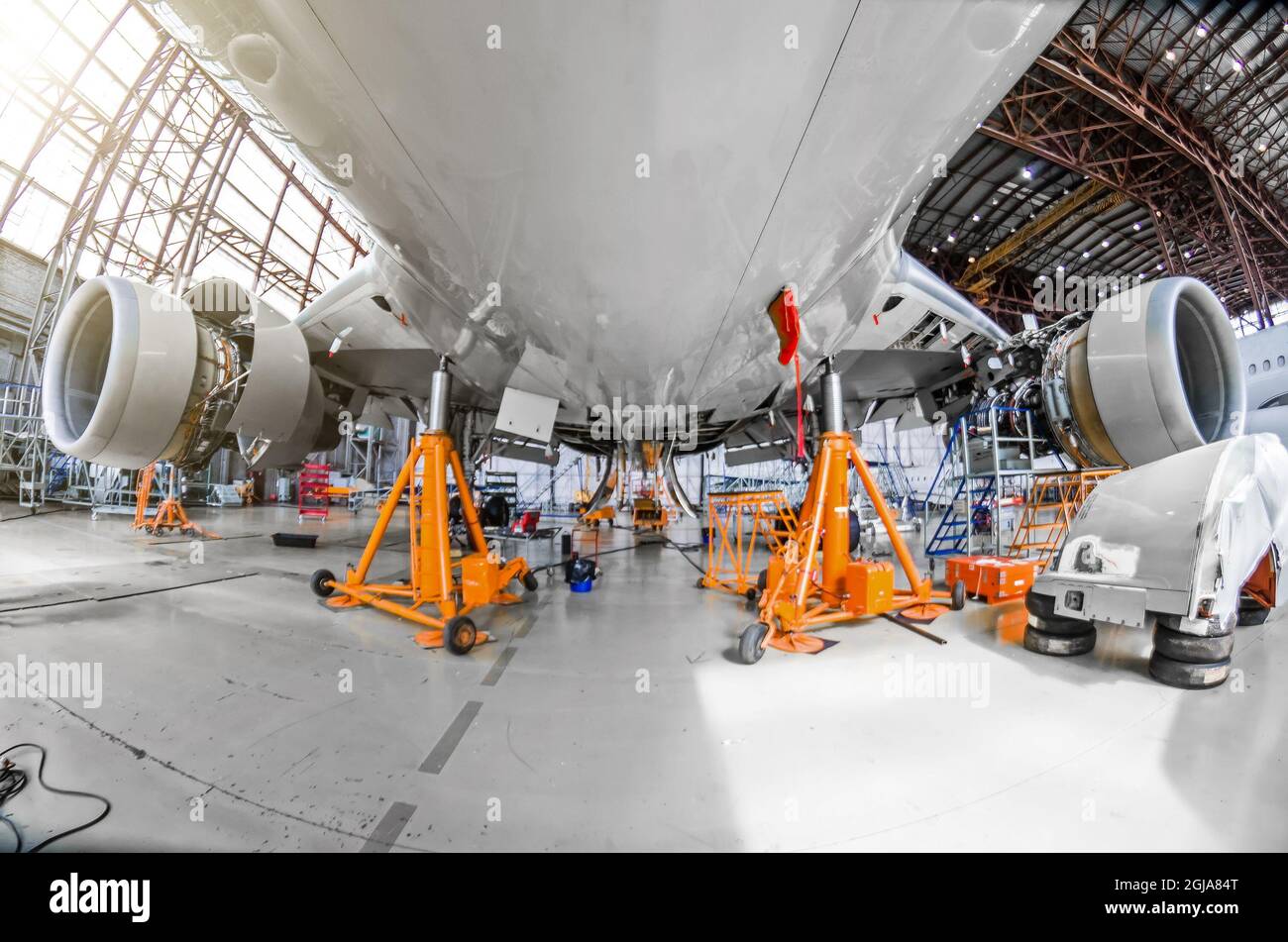 A large aircraft for service maintenance on special jacks in the hangar ...