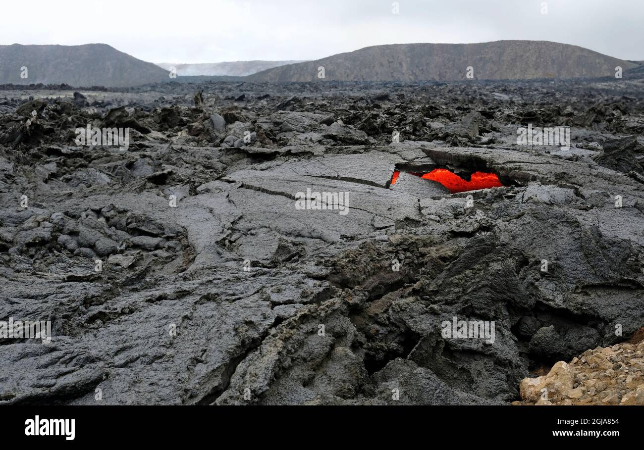 Glimpses of lava through a heart-shaped opening near Iceland's newest ...