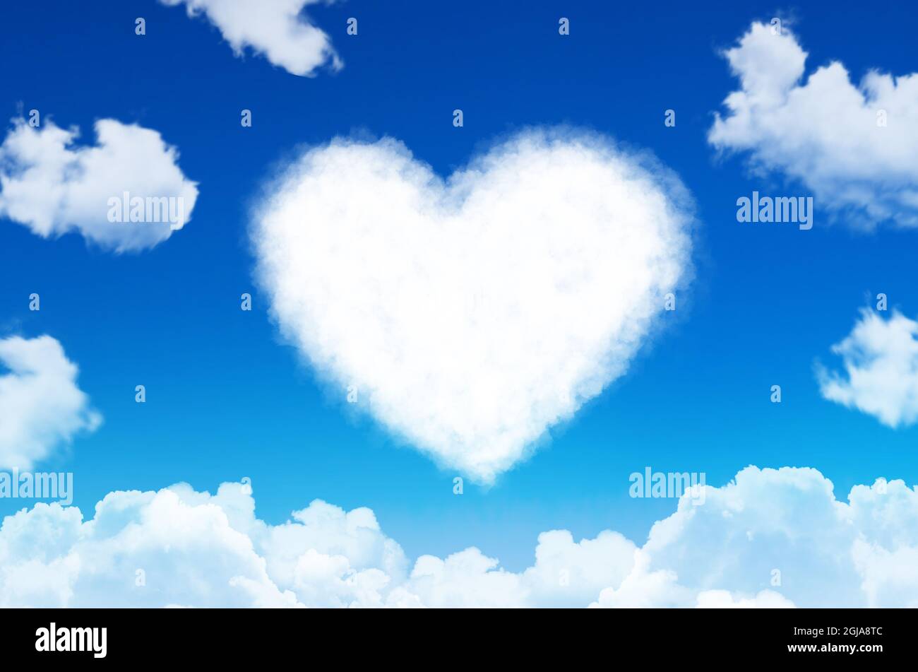 Heart of clouds symbol of love on blue sky Stock Photo - Alamy