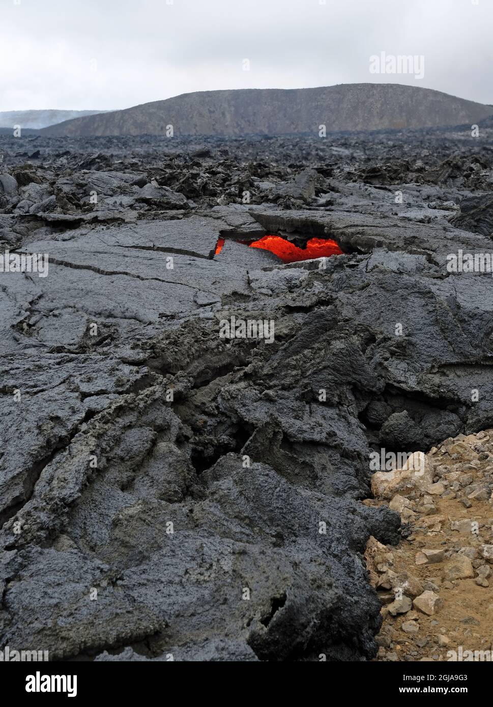 Glimpses of lava through a heart-shaped opening near Iceland's newest ...