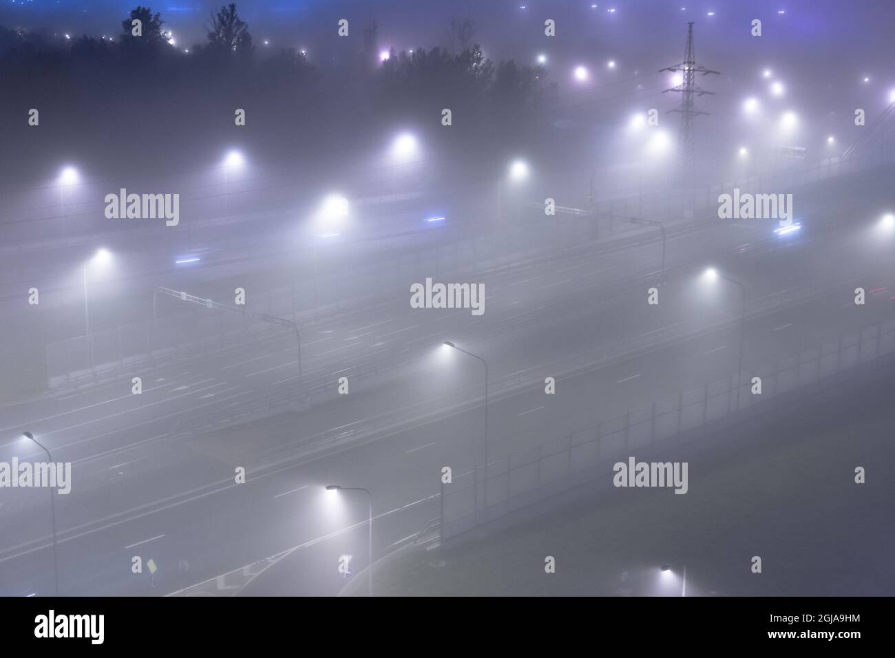 Thick fog over night highway in the city. View from above Stock Photo ...