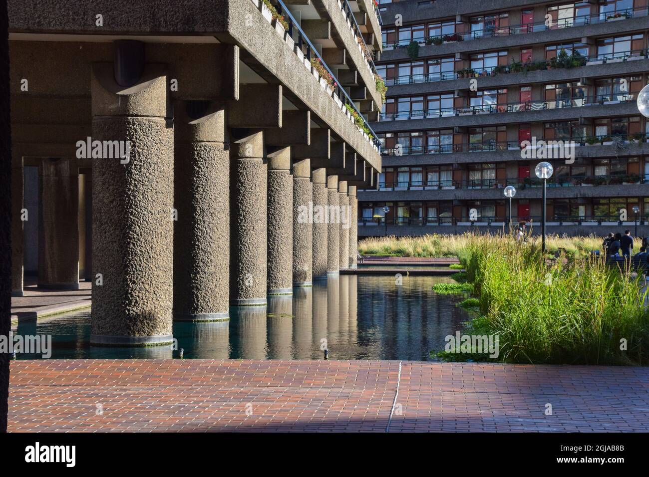 Pond and buildings details at the Barbican Centre and Estate, London ...