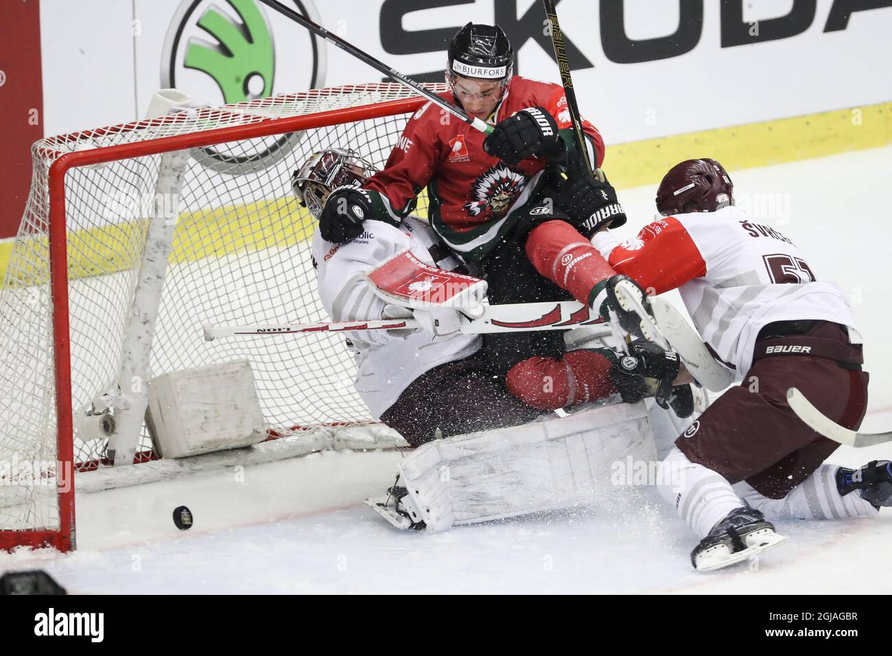 Frolunda's Casey Wellman (9, top) falls over Sparta's goalkeeper Tomas ...