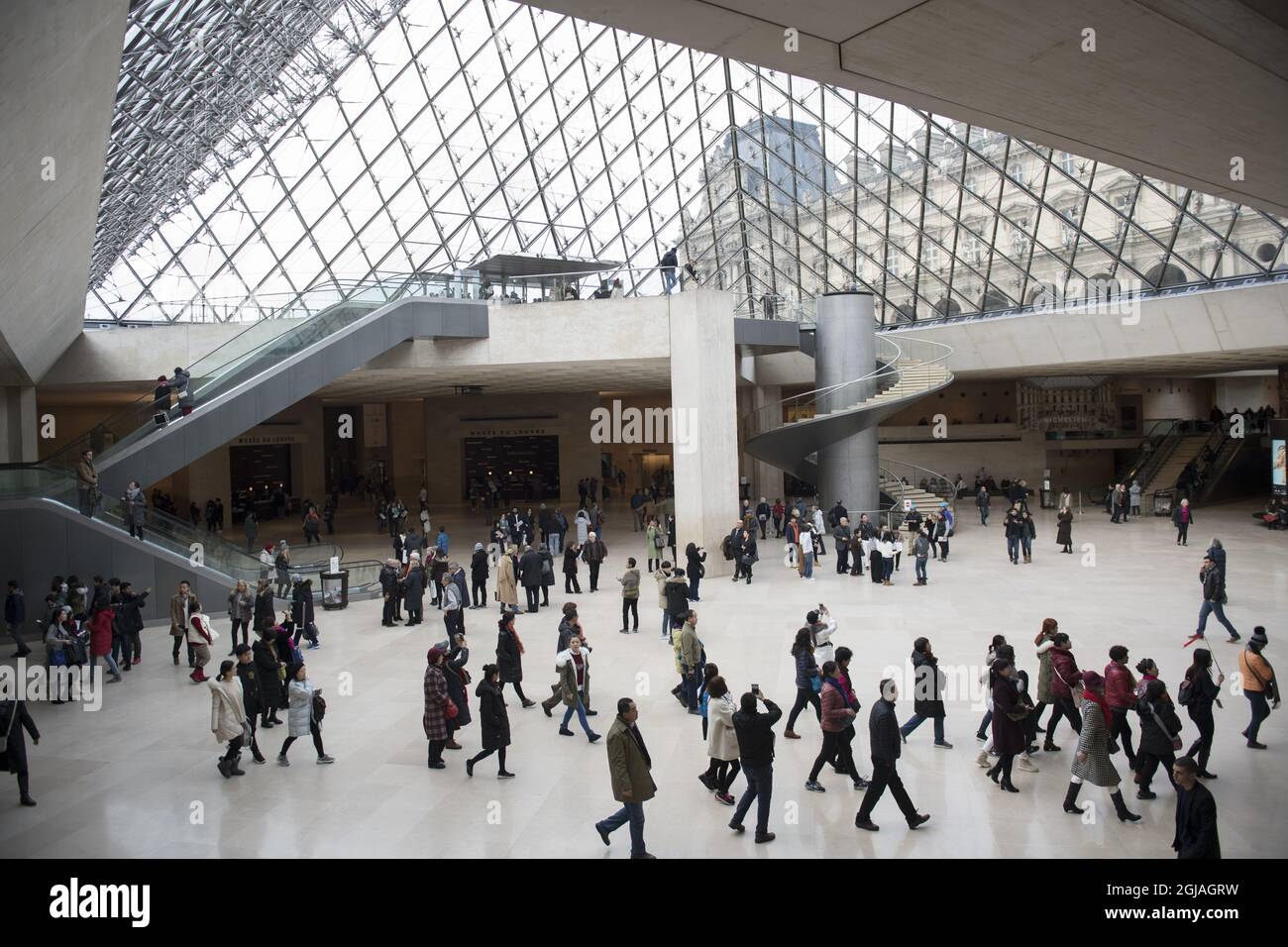 The glass pyramid in the entrance of the Louvre Museum in Paris France ...