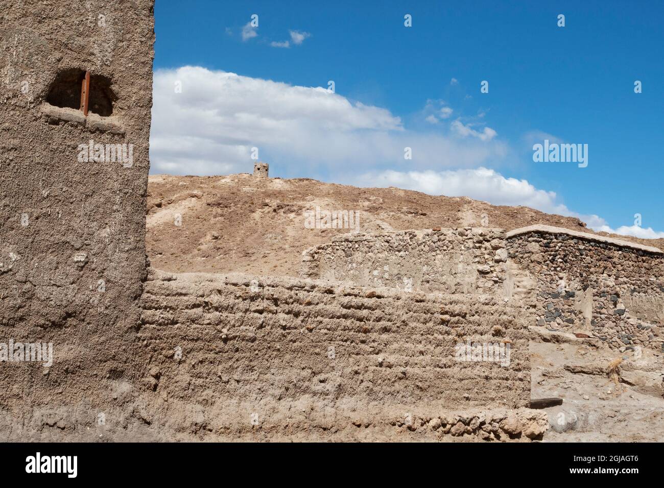Bolivia, Atacama Desert. Old mud brick buildings stand in the desert ...