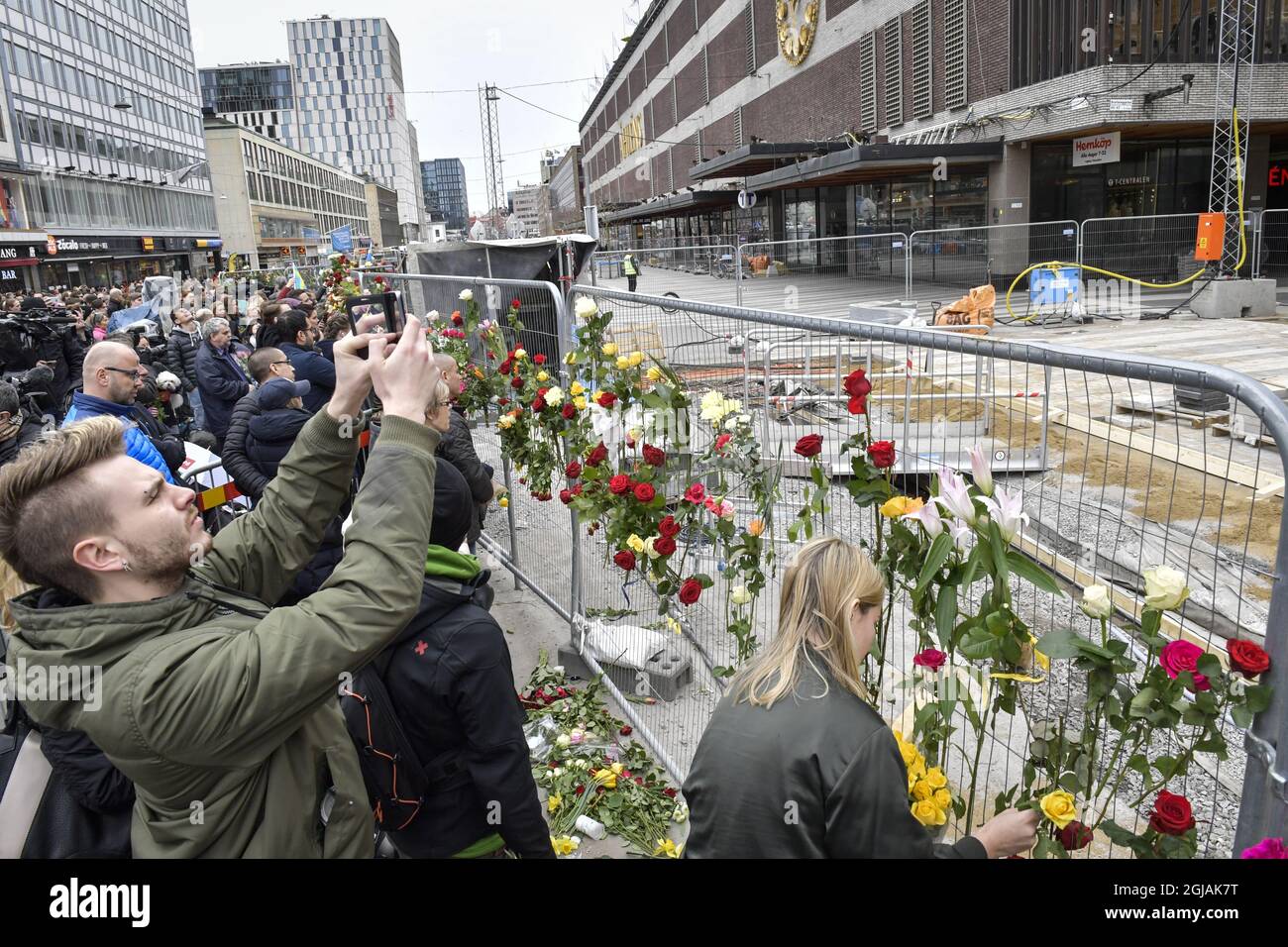 STOCKHOLM 2017-04-08 People gather at the crime scene near Ahlens ...