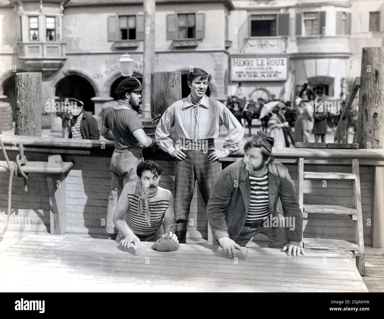 Bruce Cabot (standing, center), Andy Devine (kneeling, right), on-set ...