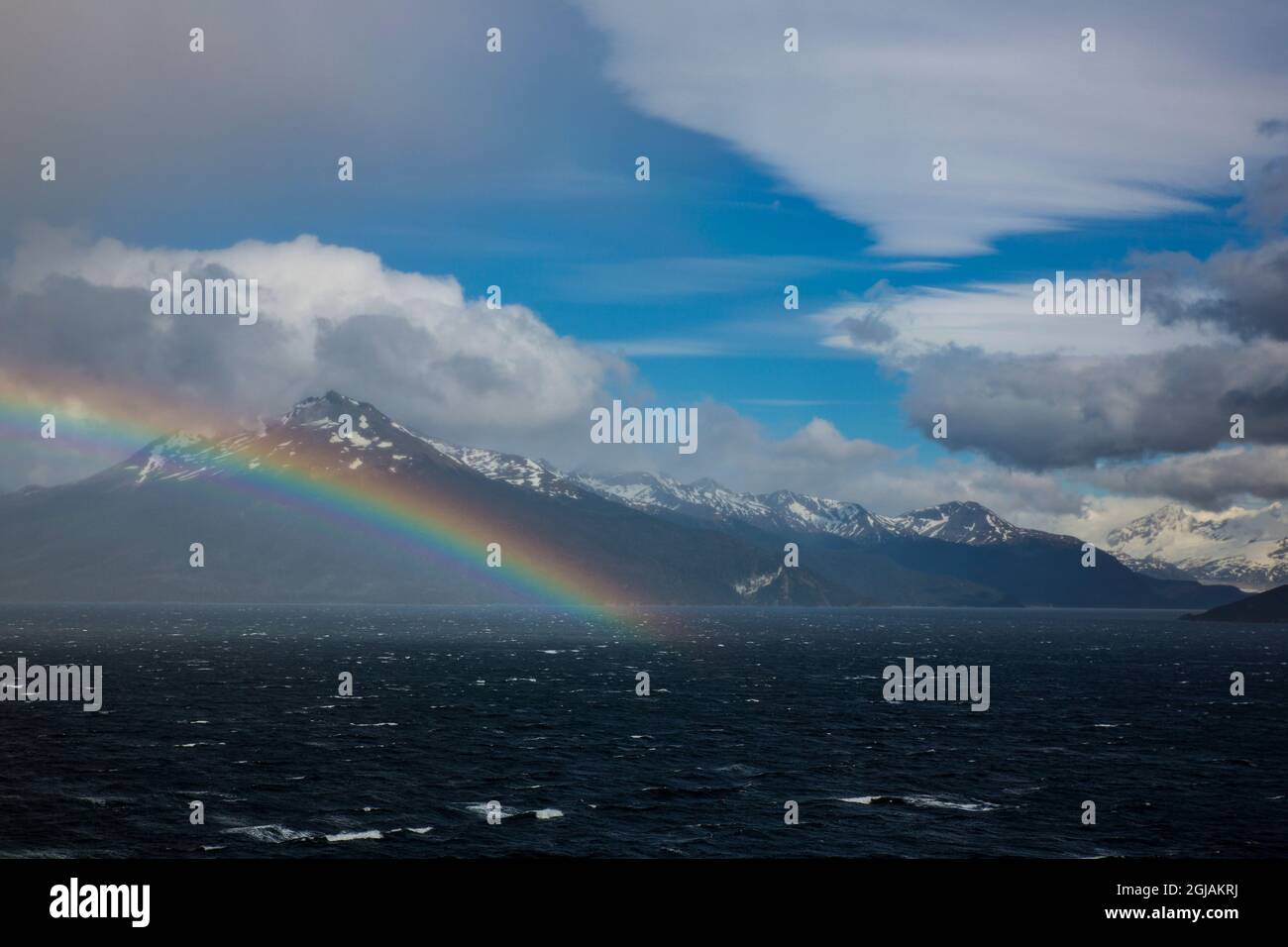 Chile, Patagonia. Rainbow with mountain in the background Stock Photo ...