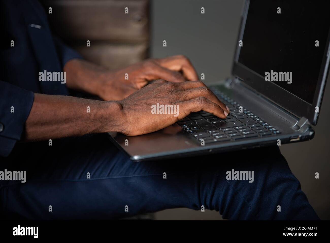 beautiful african adult man hand typed a laptop Stock Photo - Alamy
