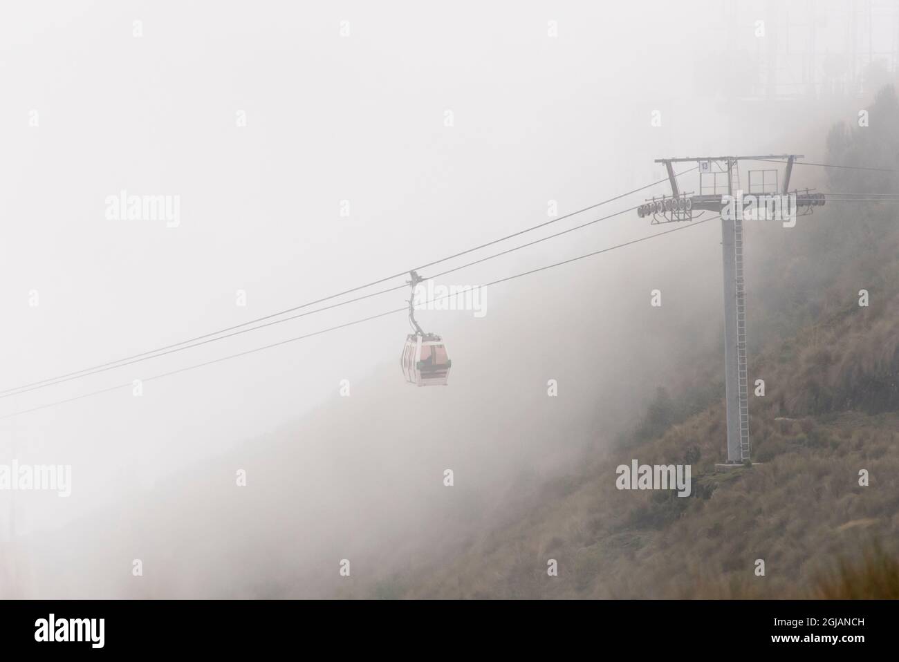 Ecuador, Quito. TeleferiQo cable car on Pichincha Volcano rises to ...