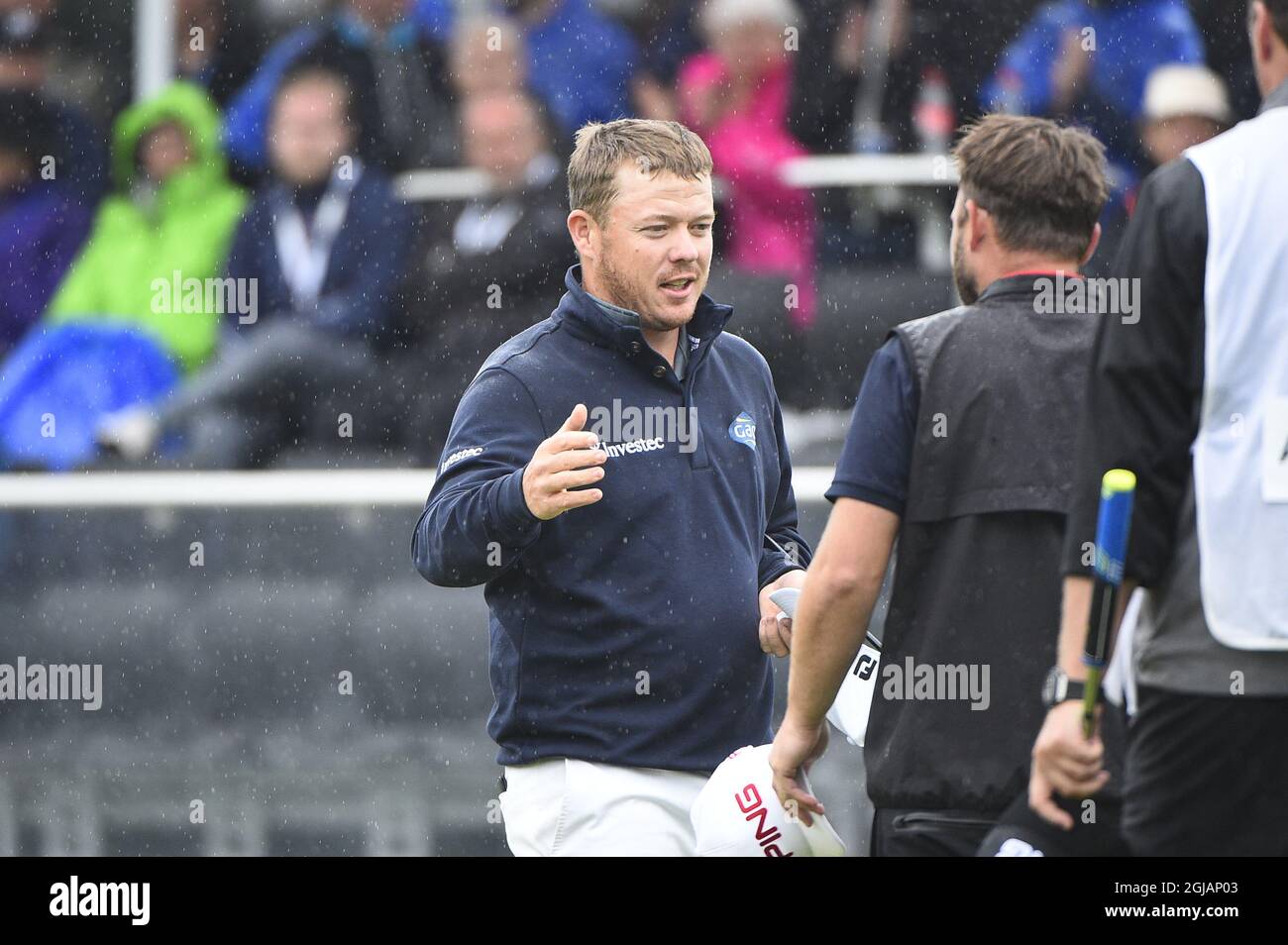BARSEBACK 20170604 South Africa's George Coetzee (L) on green 18 speaks ...
