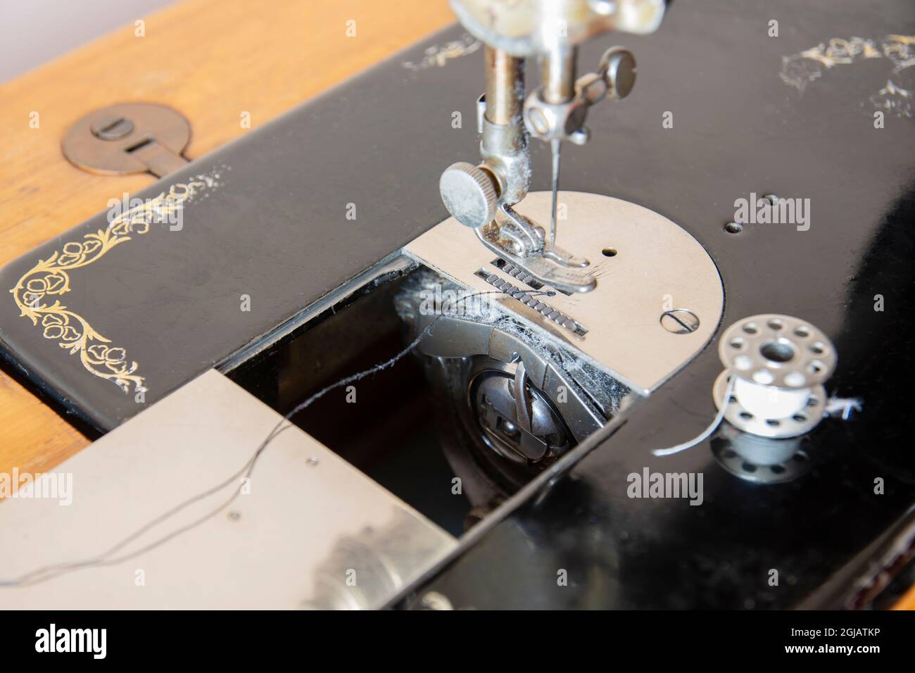 very old model, antique pedal sewing machine and table Stock Photo - Alamy