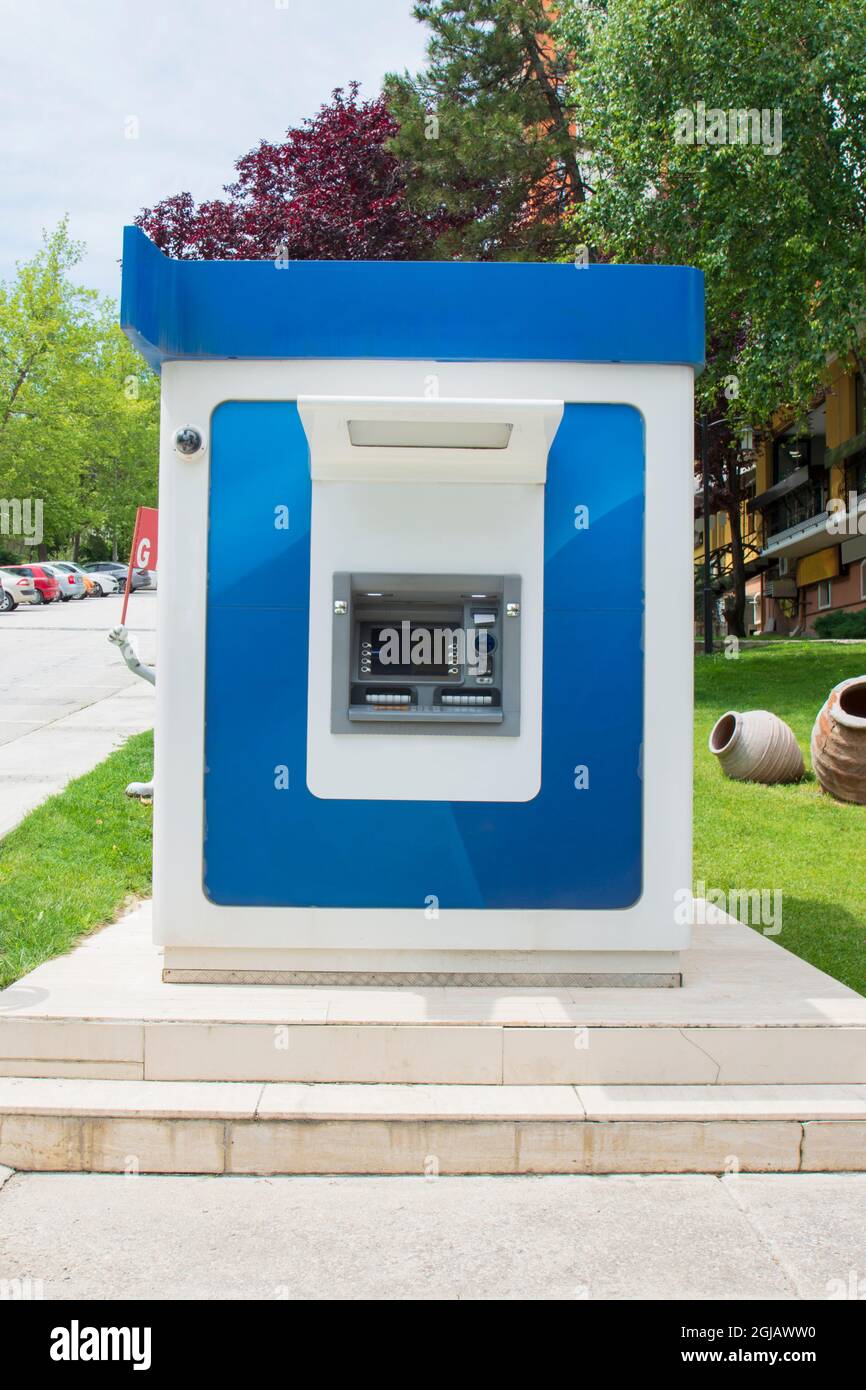 With one cash machine, ATM, dustbin and security camera in the park ...