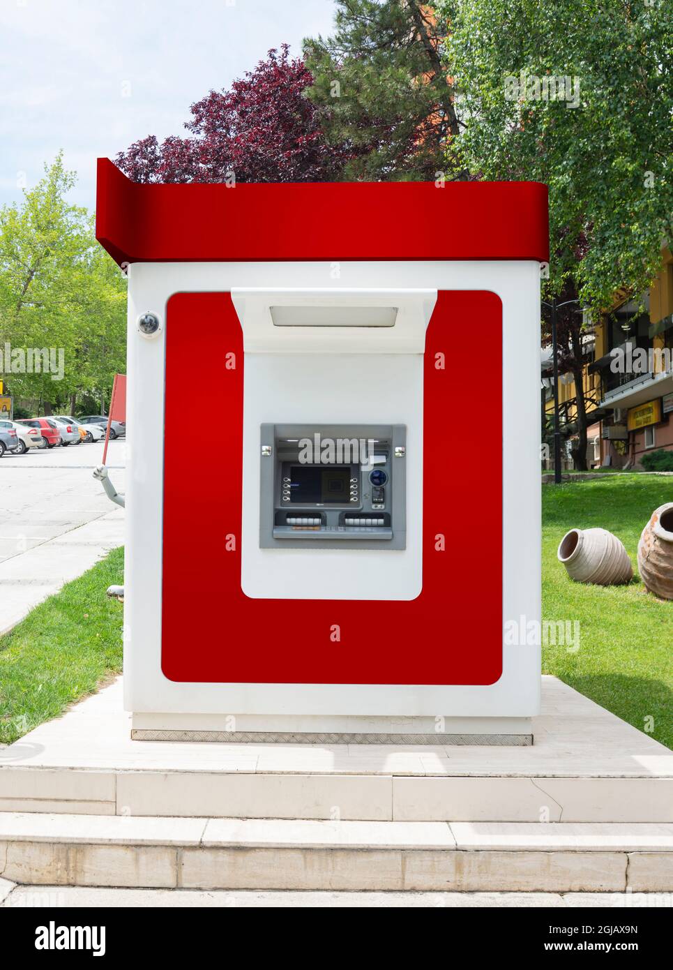 with one cash machine, ATM, dustbin and security camera in the park ...