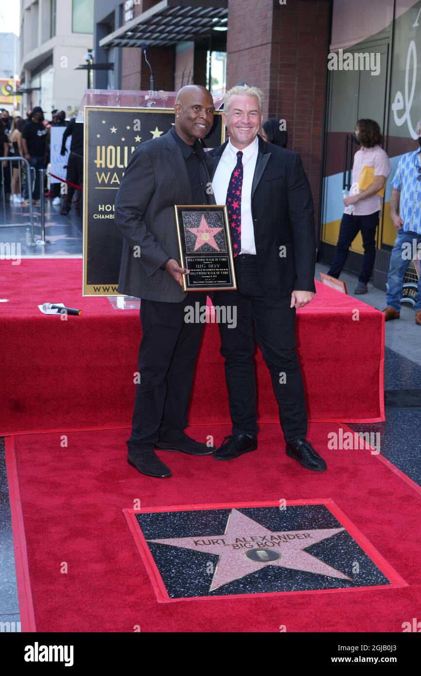 Radio personality Kurt Alexander aka Big Boy (left) poses at a ceremony ...