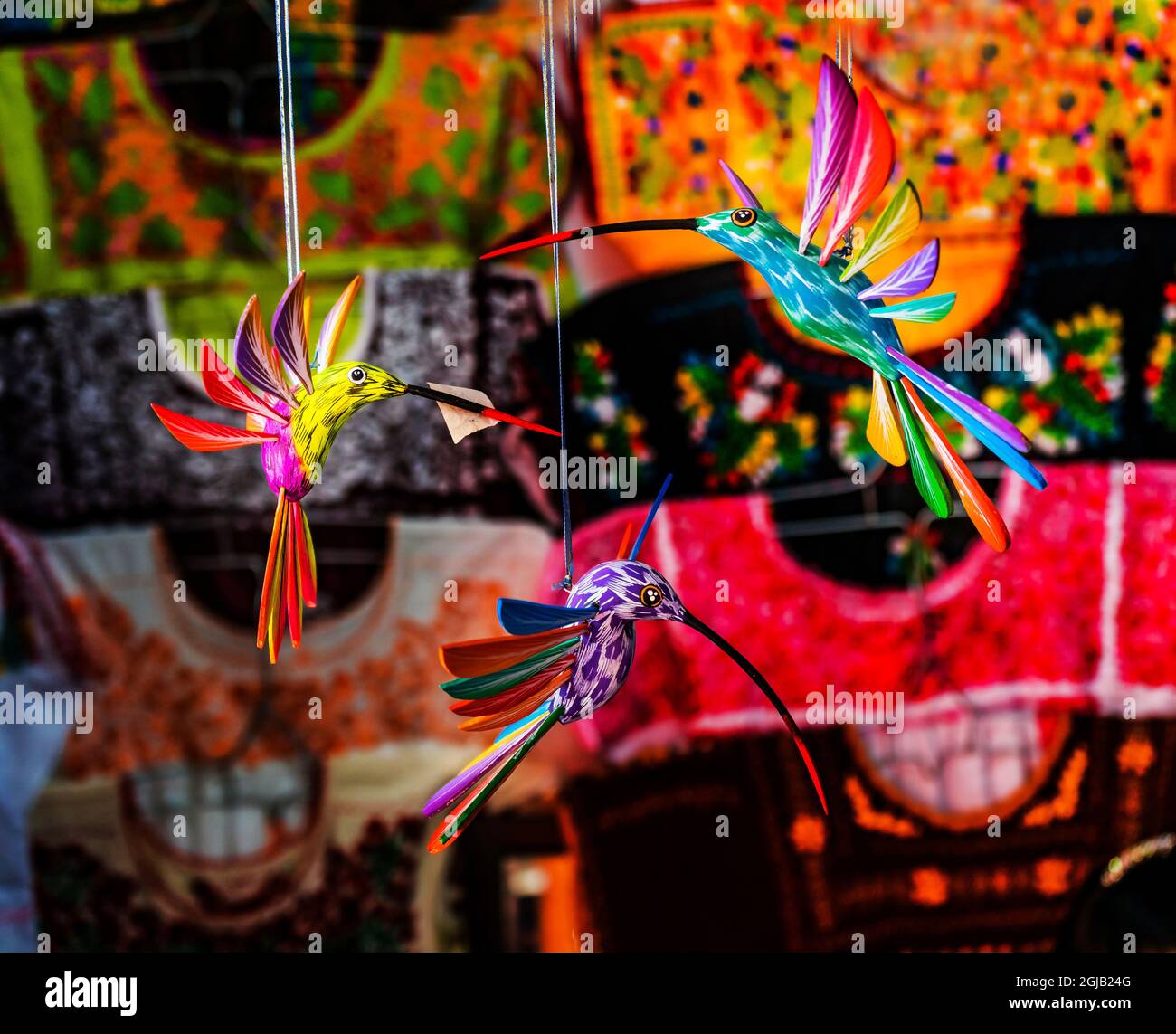 Colorful wooden hummingbirds textiles, Oaxaca, Mexico Stock Photo - Alamy