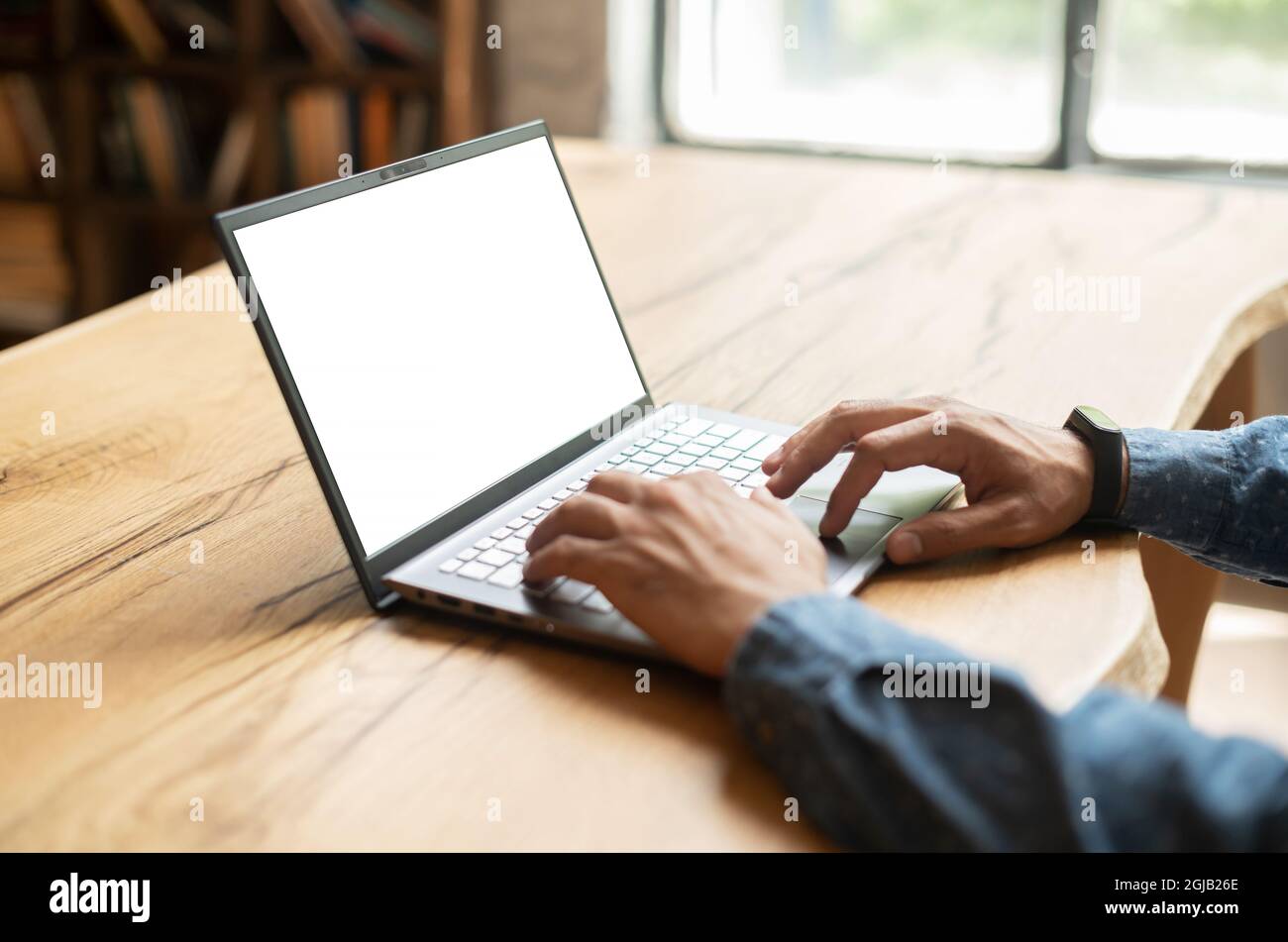 Male hands on the laptop keyboard, close-up picture of hands of man ...