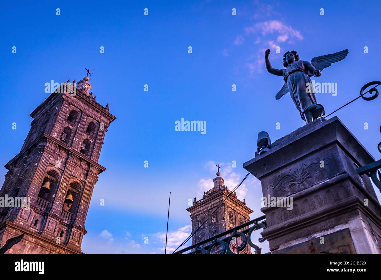 Angel statues outside cathedral at sunset, Puebla, Mexico. Built in 15 ...