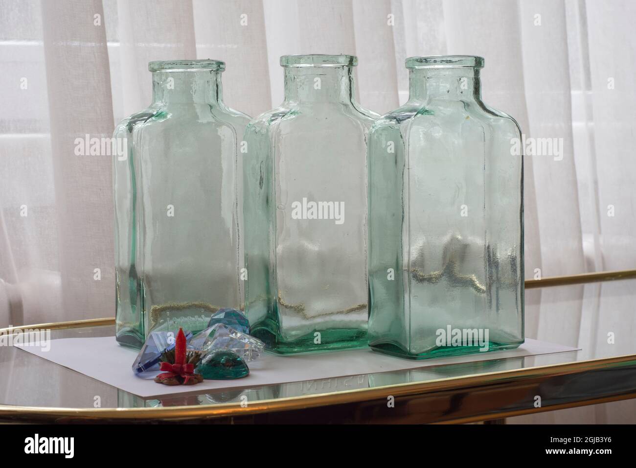 Three empty wine bottles hi-res stock photography and images - Alamy