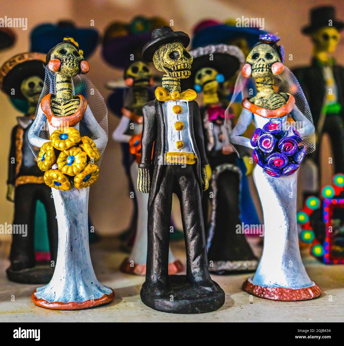 Colorful Mexican ceramic. Day of the Dead skeleton statues handicrafts ...