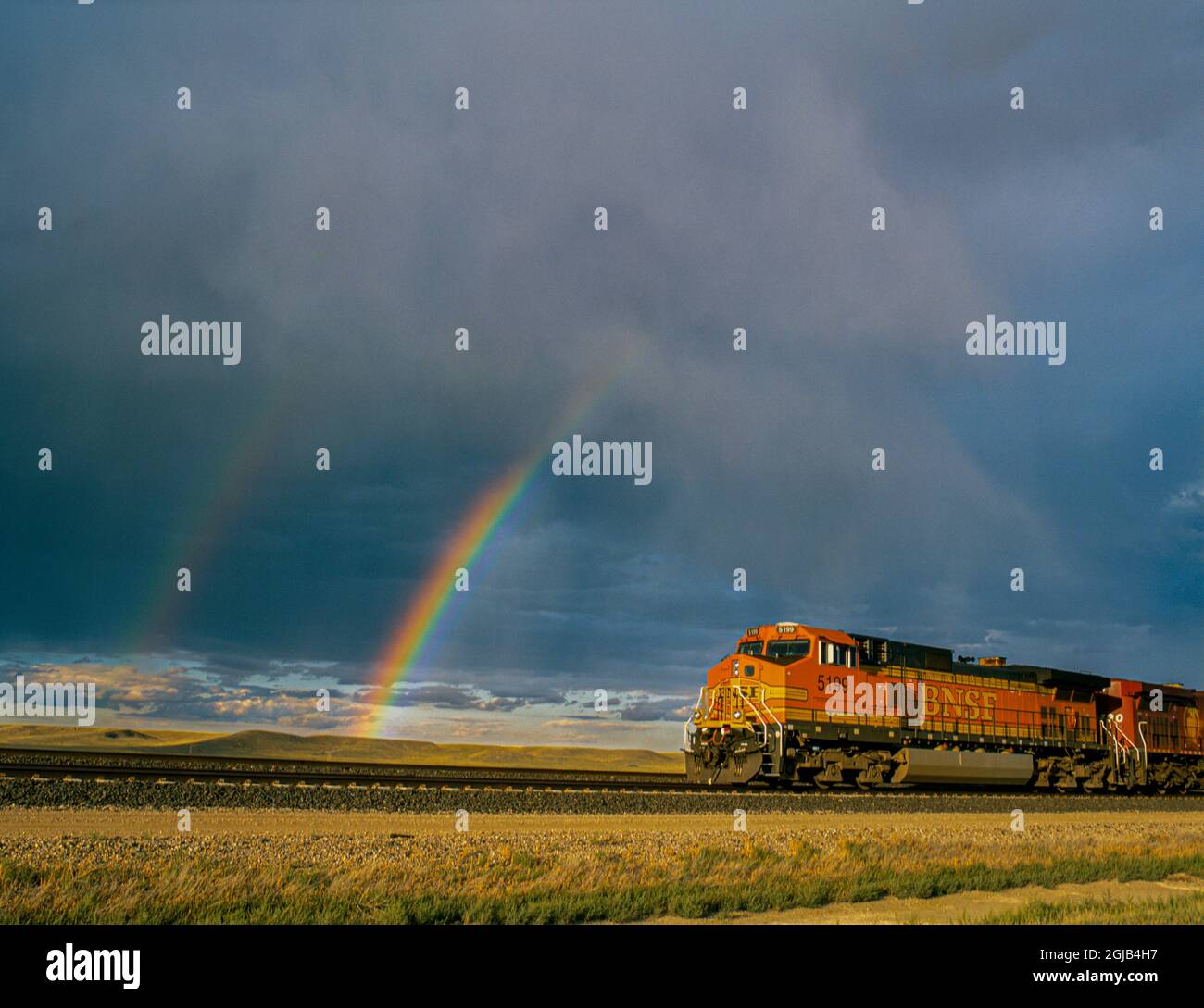 Rainbow and train, USA Stock Photo - Alamy